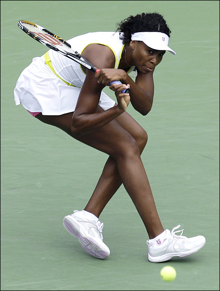 Venus Williams of the United States returns a shot to... - The Korea Times