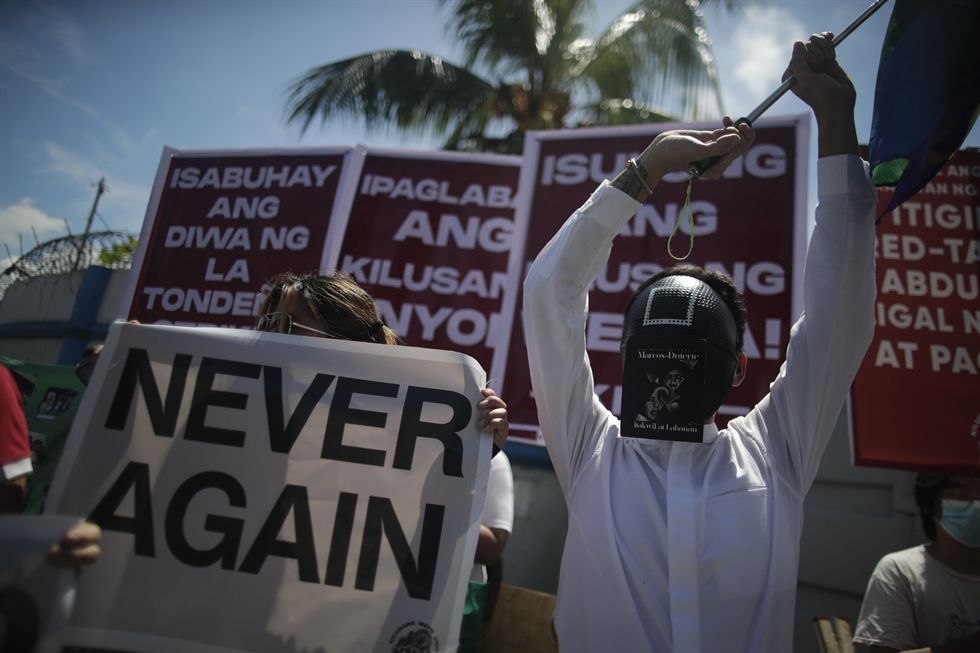 Philippine protesters vow to 'never forget' Marcos era abuses - The ...