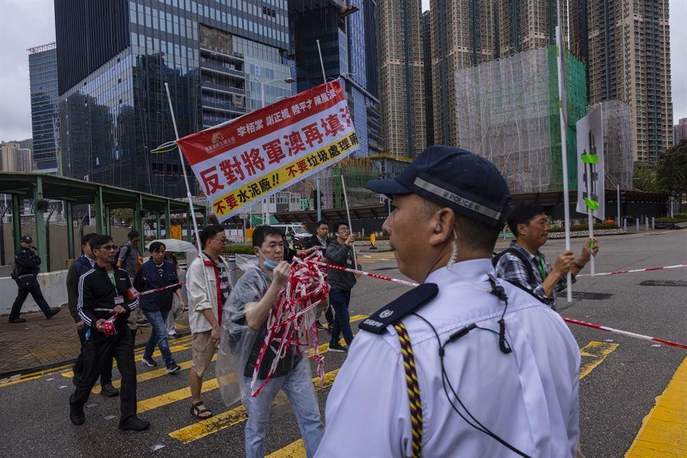 Hong Kong police keep tight tabs on first authorized protest in years ...